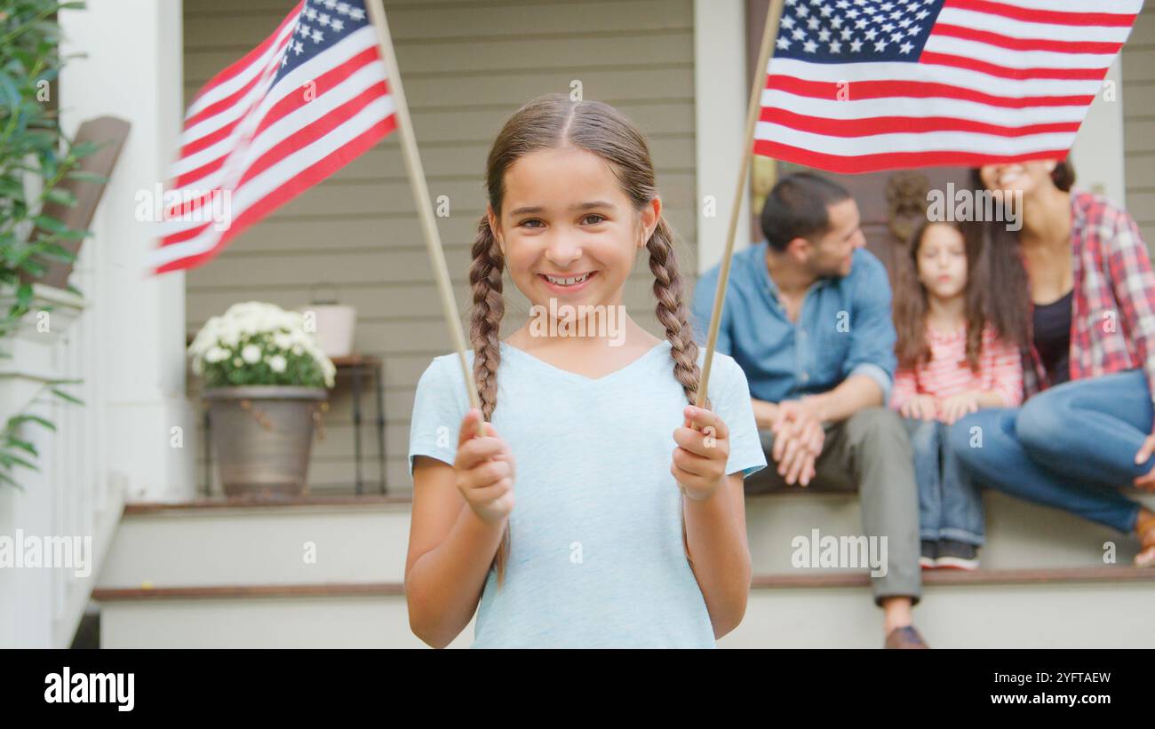 Portrait Of Girl With Family Outside House Holding American Flags Stock ...