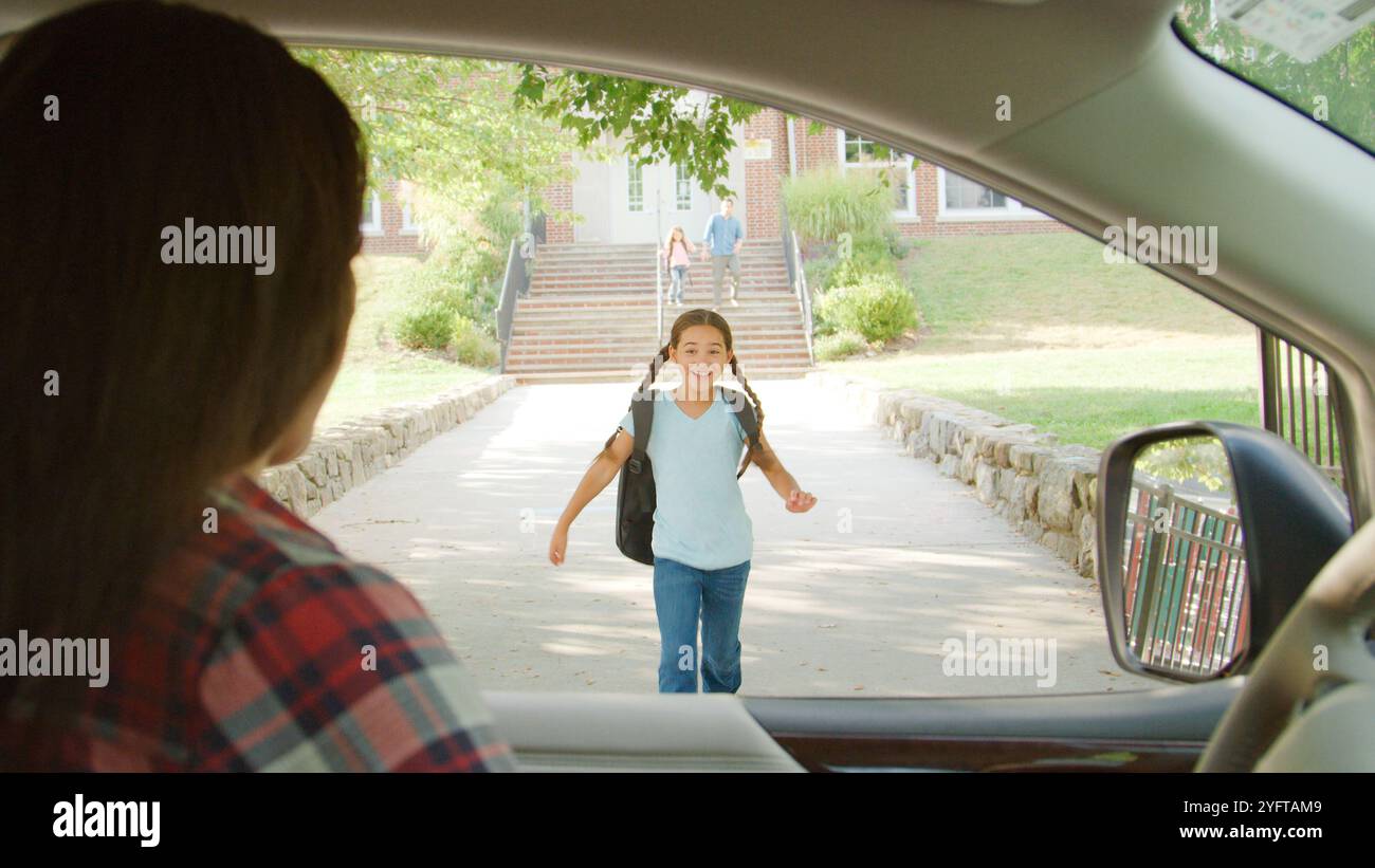 Happy girl collecting school hi-res stock photography and images - Alamy