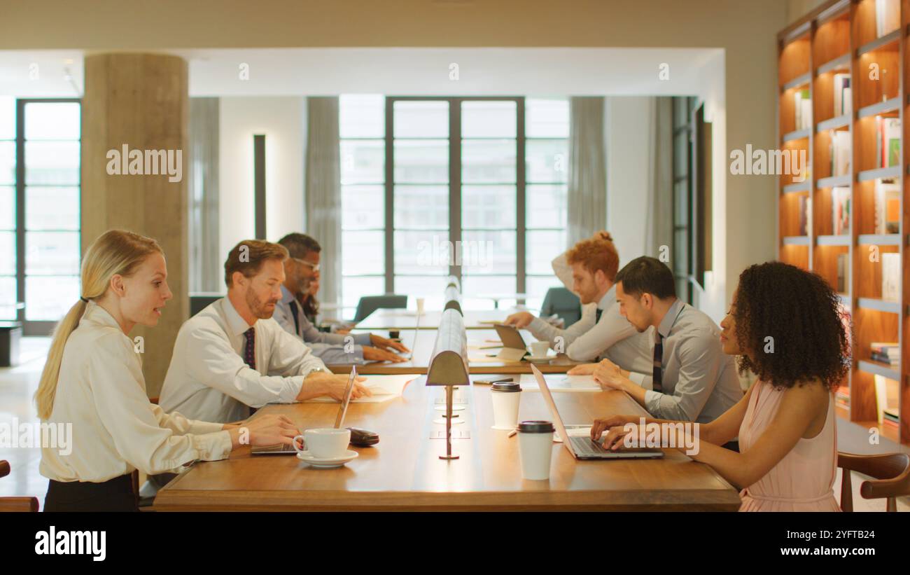 Female office worker seated desk hi-res stock photography and images ...