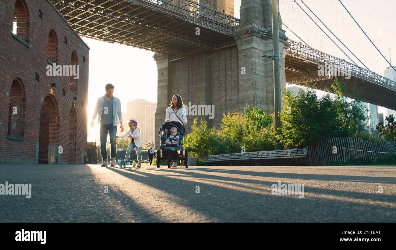 Family Day Out With Mum Pushing Baby In Buggy As They Walk By Brooklyn ...