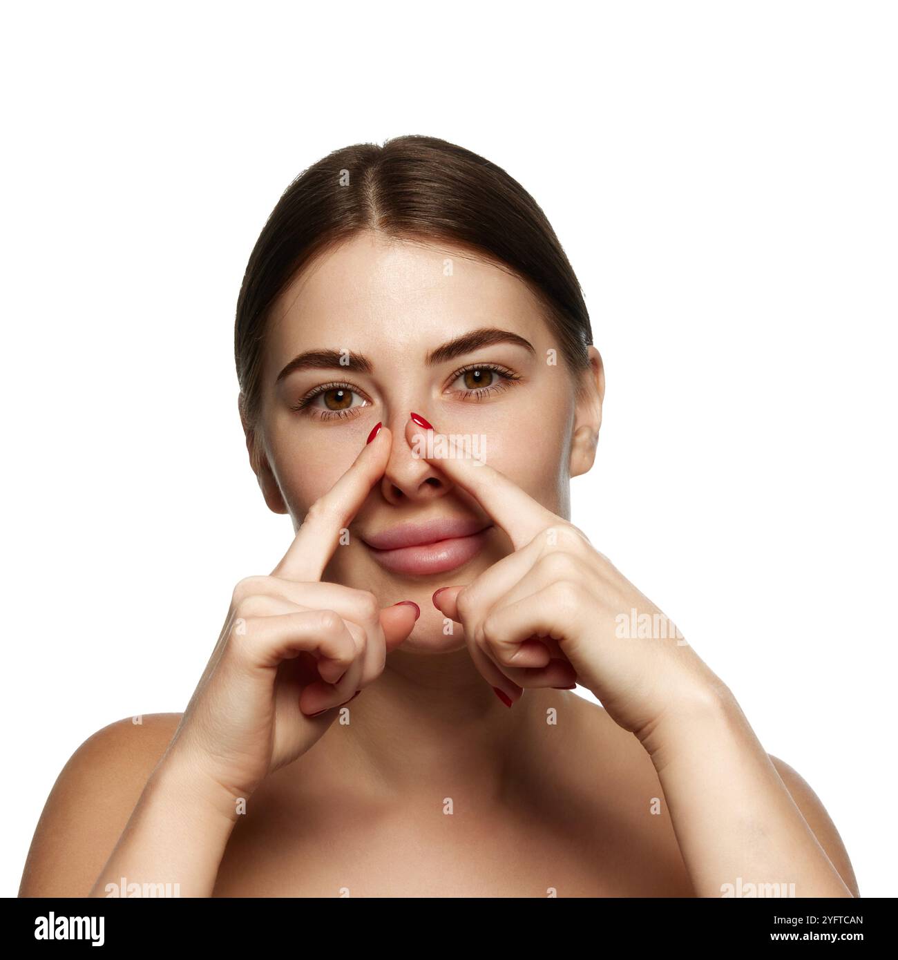 Beauty routine. Woman pinching her nose bridge as part of facial ...