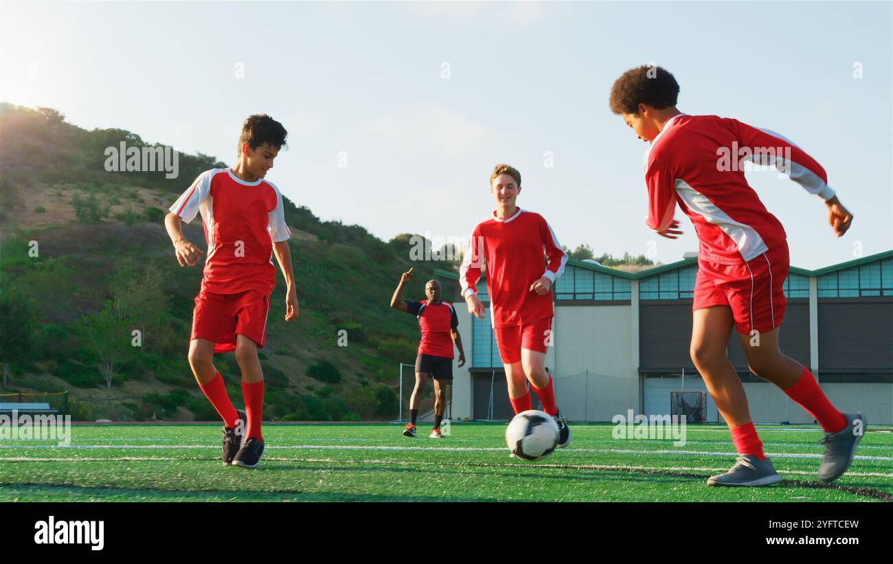 Group Of Male High School Students With Coach Playing In Soccer Team ...