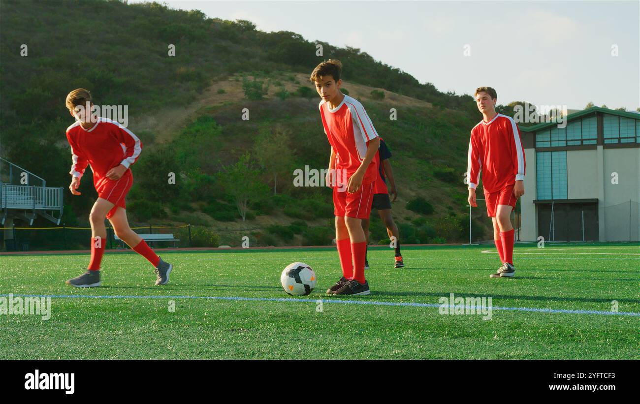 Group Of Male High School Students With Coach Playing In Soccer Team ...