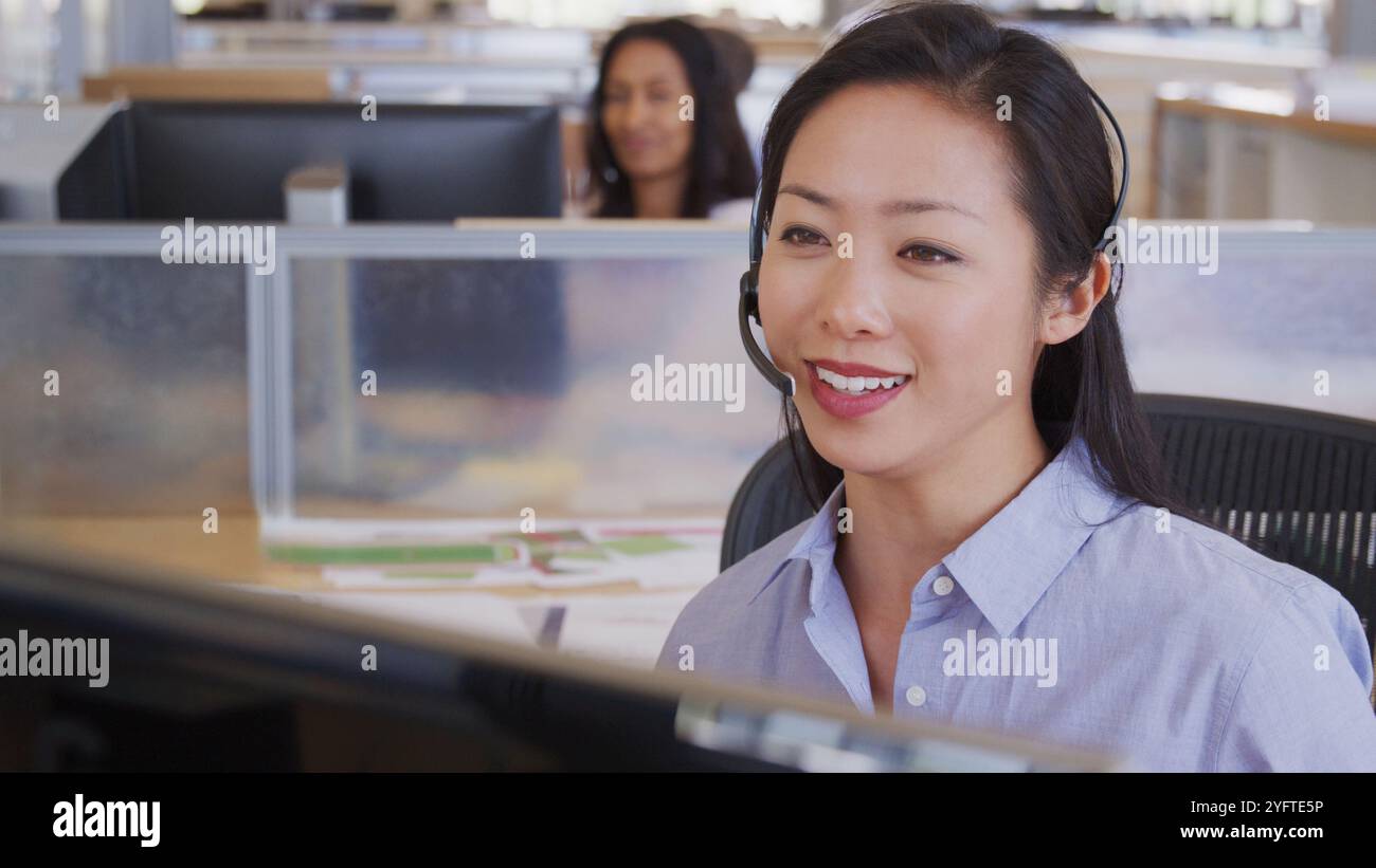 Happy chinese customer support team hi-res stock photography and images - Alamy