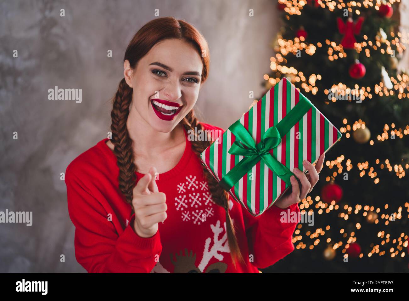 Photo of pretty young ginger female hold gift point you dressed ...