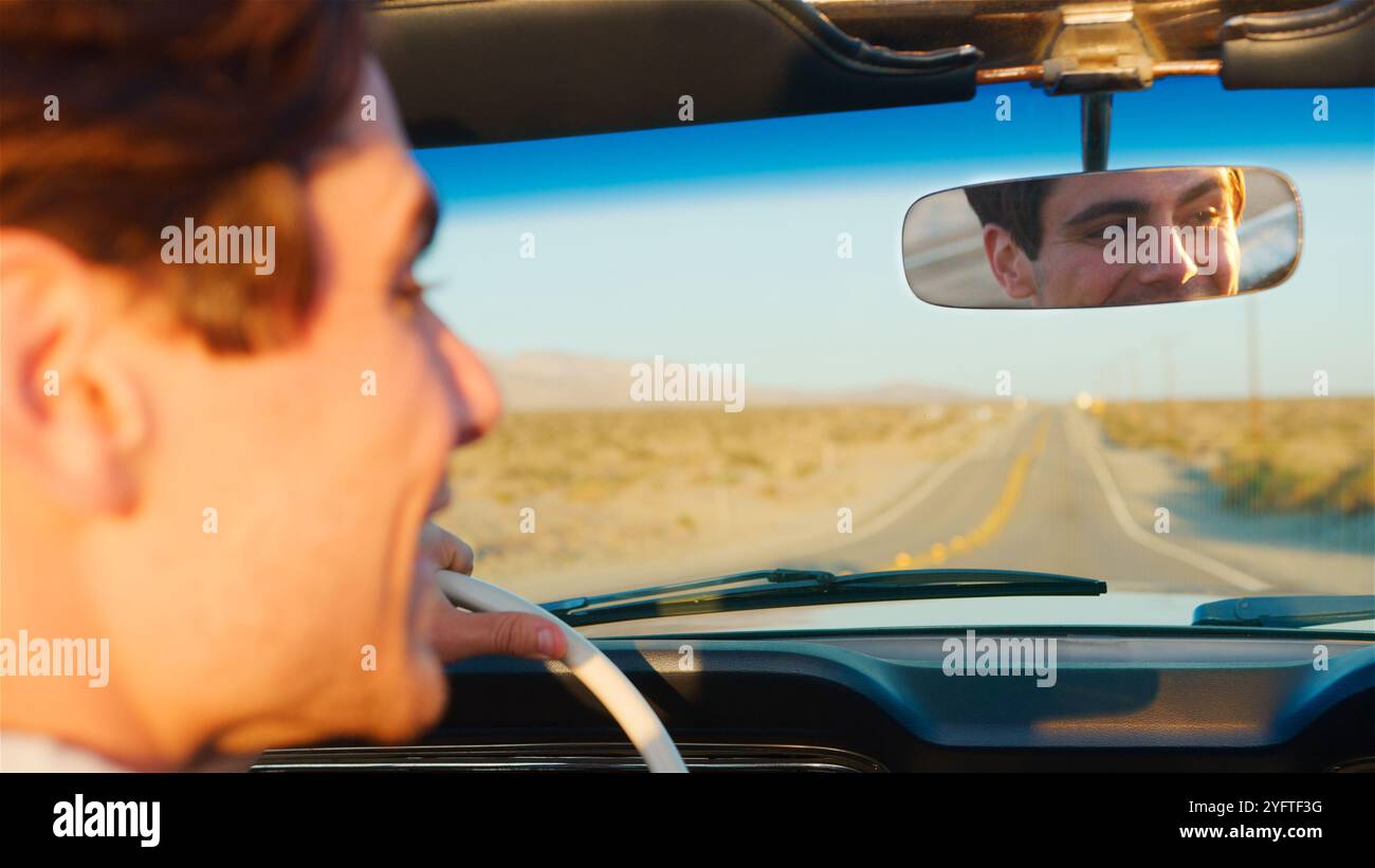 Male Driver Reflected In Mirror Driving Classic Open Top Car On Road ...