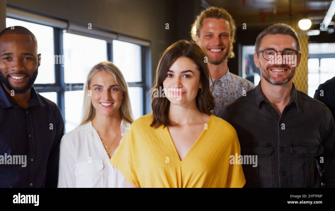 Smiling multi cultural business team hi-res stock photography and ...