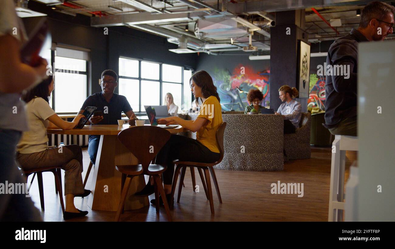 Informal Meeting Area In Modern Office With Businesspeople Meeting And ...