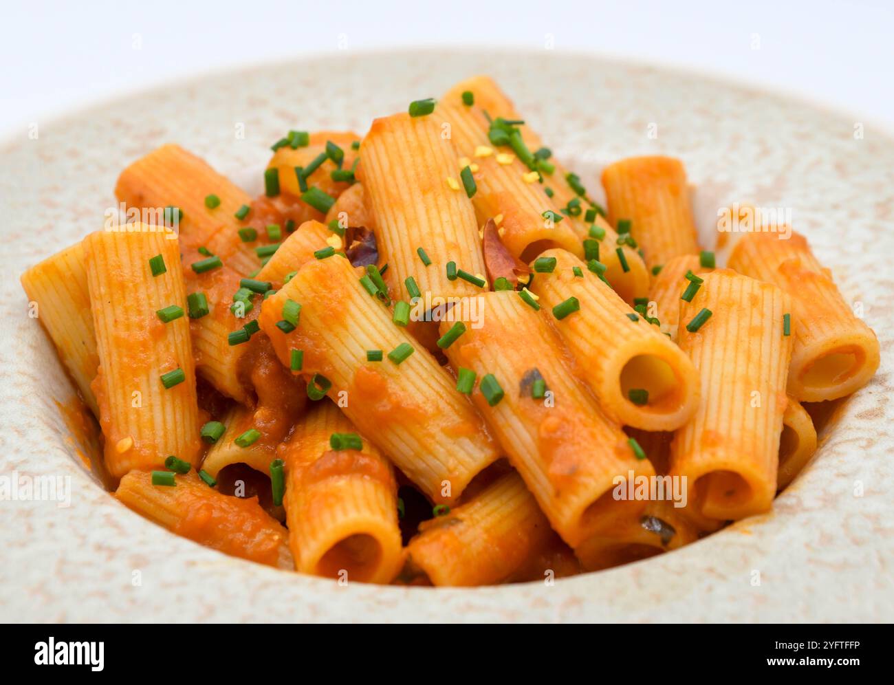 Dry egg rigatoni pasta dish with tomato sauce Stock Photo - Alamy