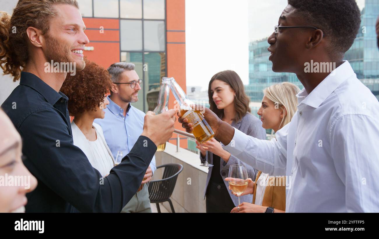 Happy team celebrating work toast hi-res stock photography and images ...