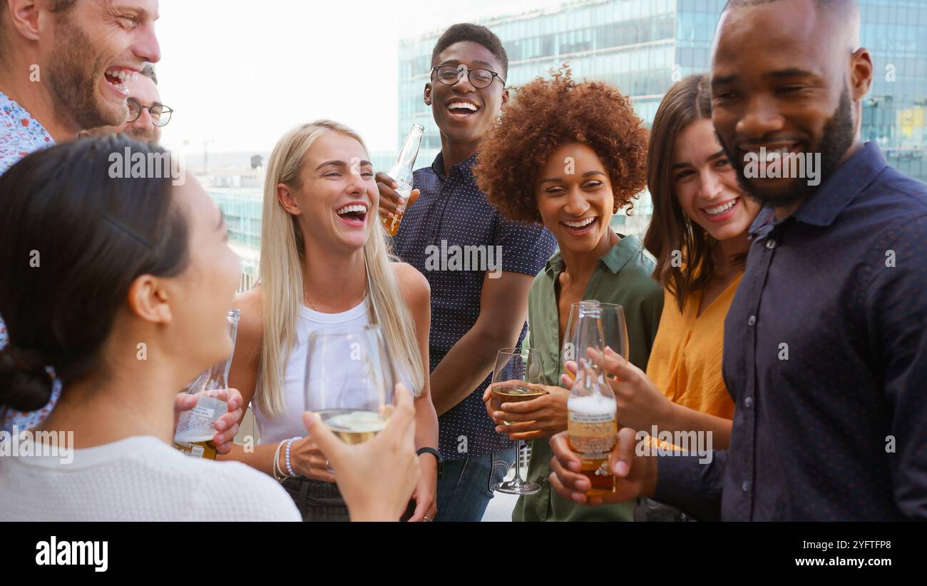 Multi-Cultural Business Team Meeting Outdoors For After Work Drinks On ...