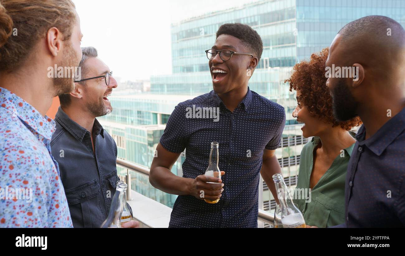 Multi-Cultural Business Team Meeting Outdoors For After Work Drinks On ...