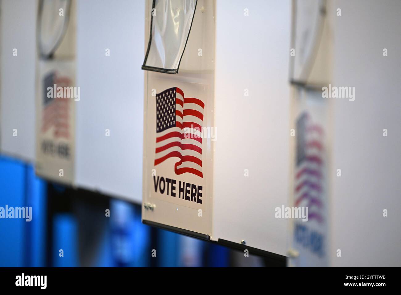 New York, USA. 05th Nov, 2024. People stand behind privacy voting ...