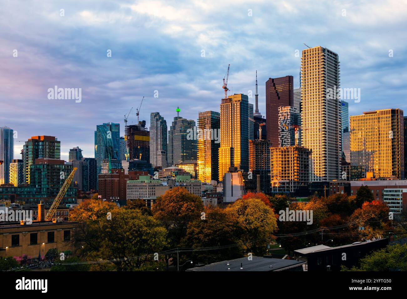 Early morning sunlight reflects off downtown buildings, creating a ...