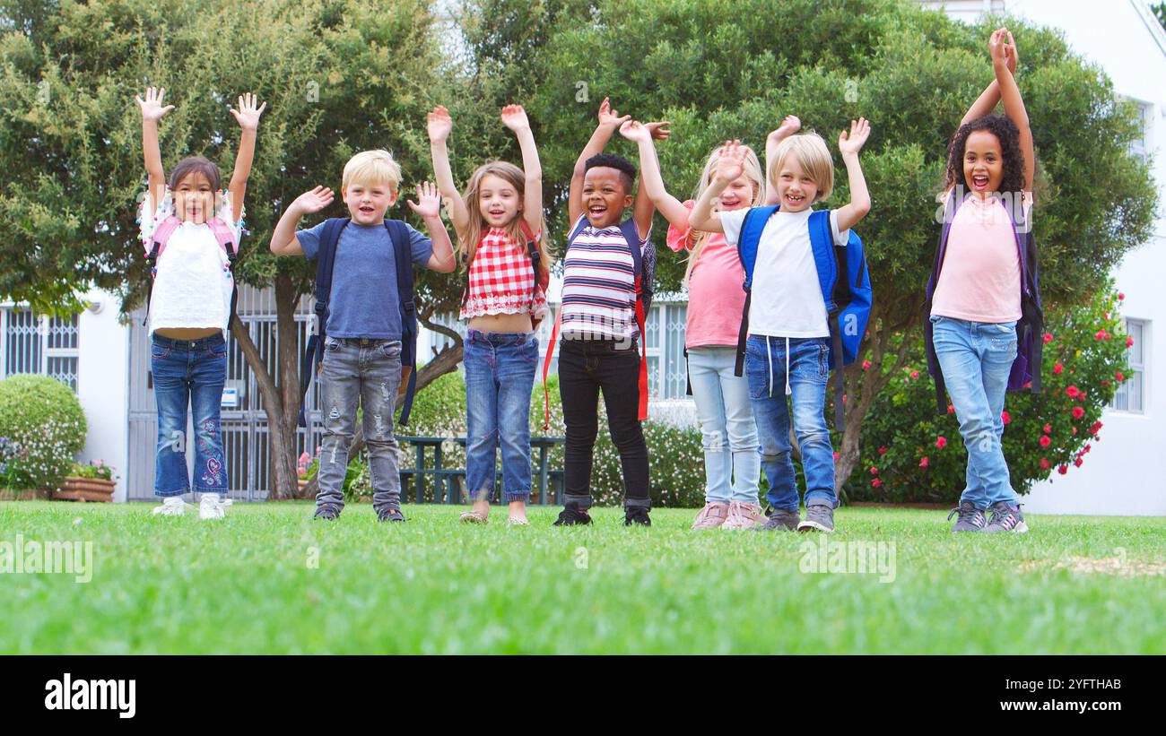 Excited Elementary School Pupils On Playing Field At Break Or Going ...