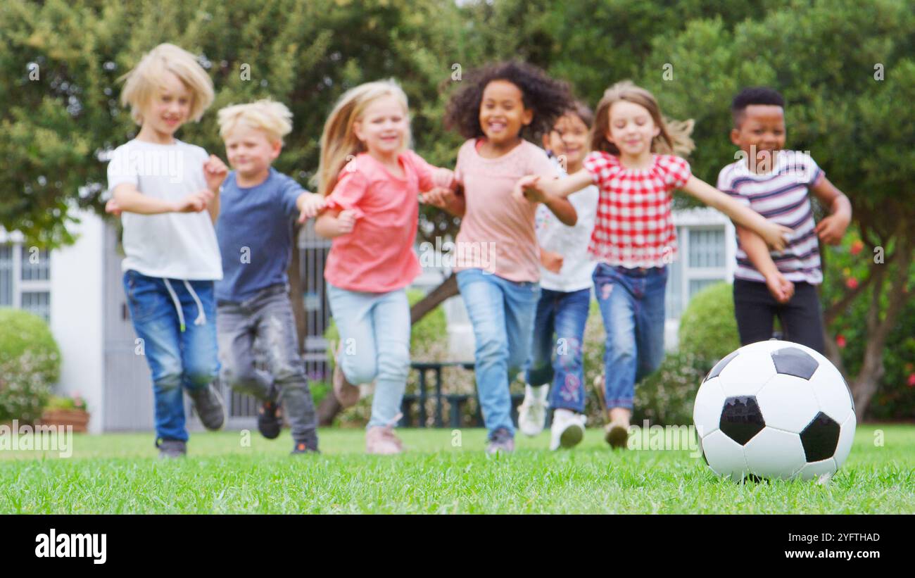 Group of african children playing football hi-res stock photography and ...