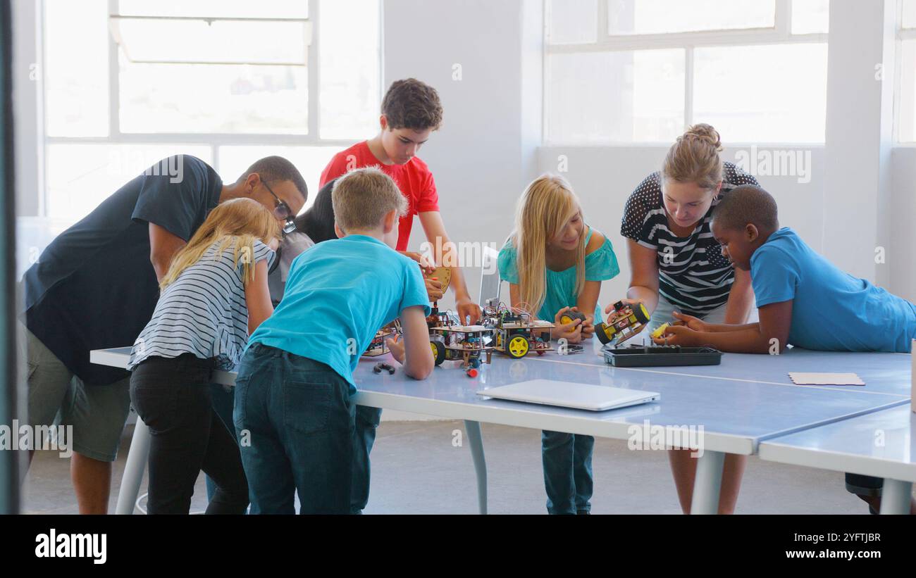 Students With Male And Female Teachers In School Computer Class Making ...