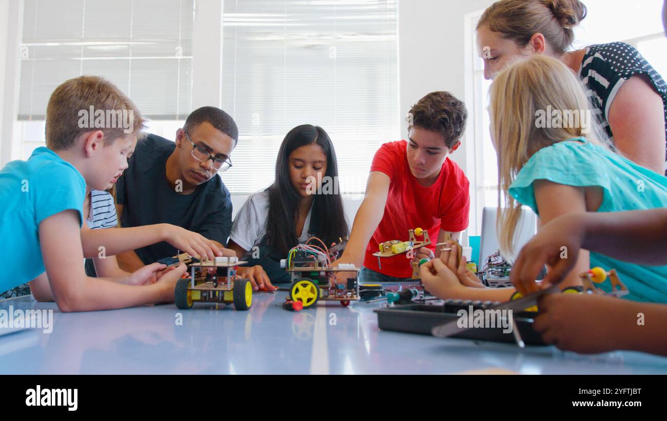 Students With Male And Female Teachers In School Computer Class Making ...