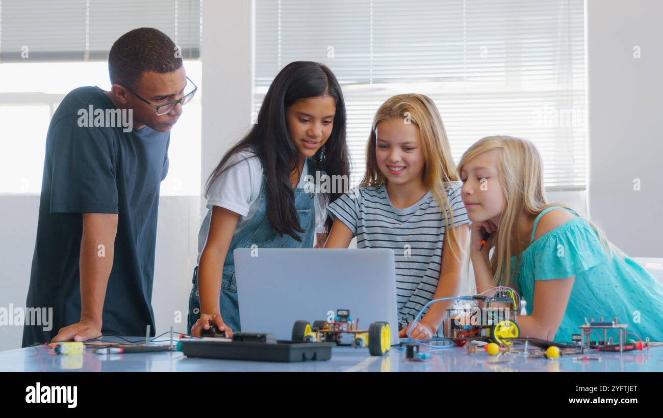 Female teacher students programming hi-res stock photography and images ...