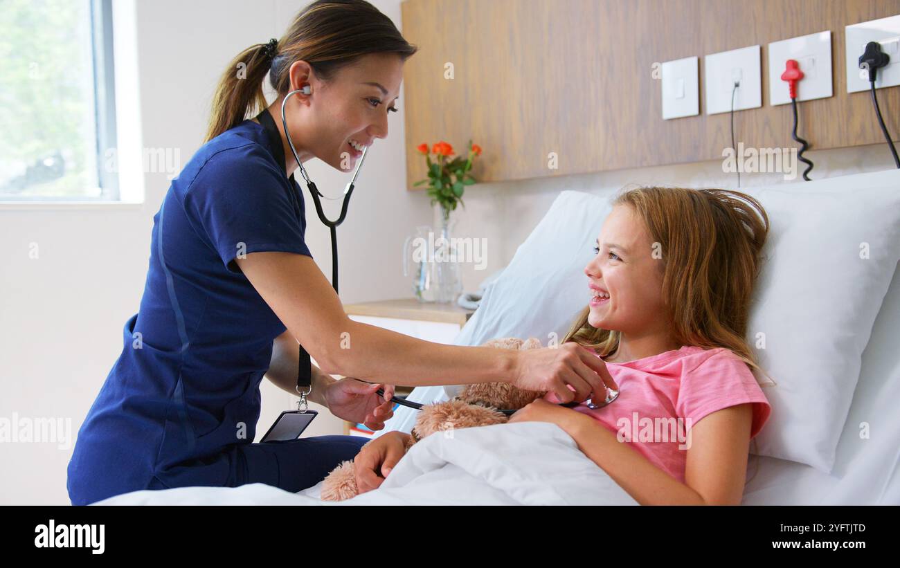 Female Doctor Listening To Girl Patient's Chest With Stethoscope In ...