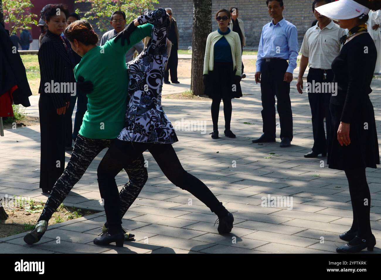 Dozens of people having a ballroom dancing lessons in the the large ...