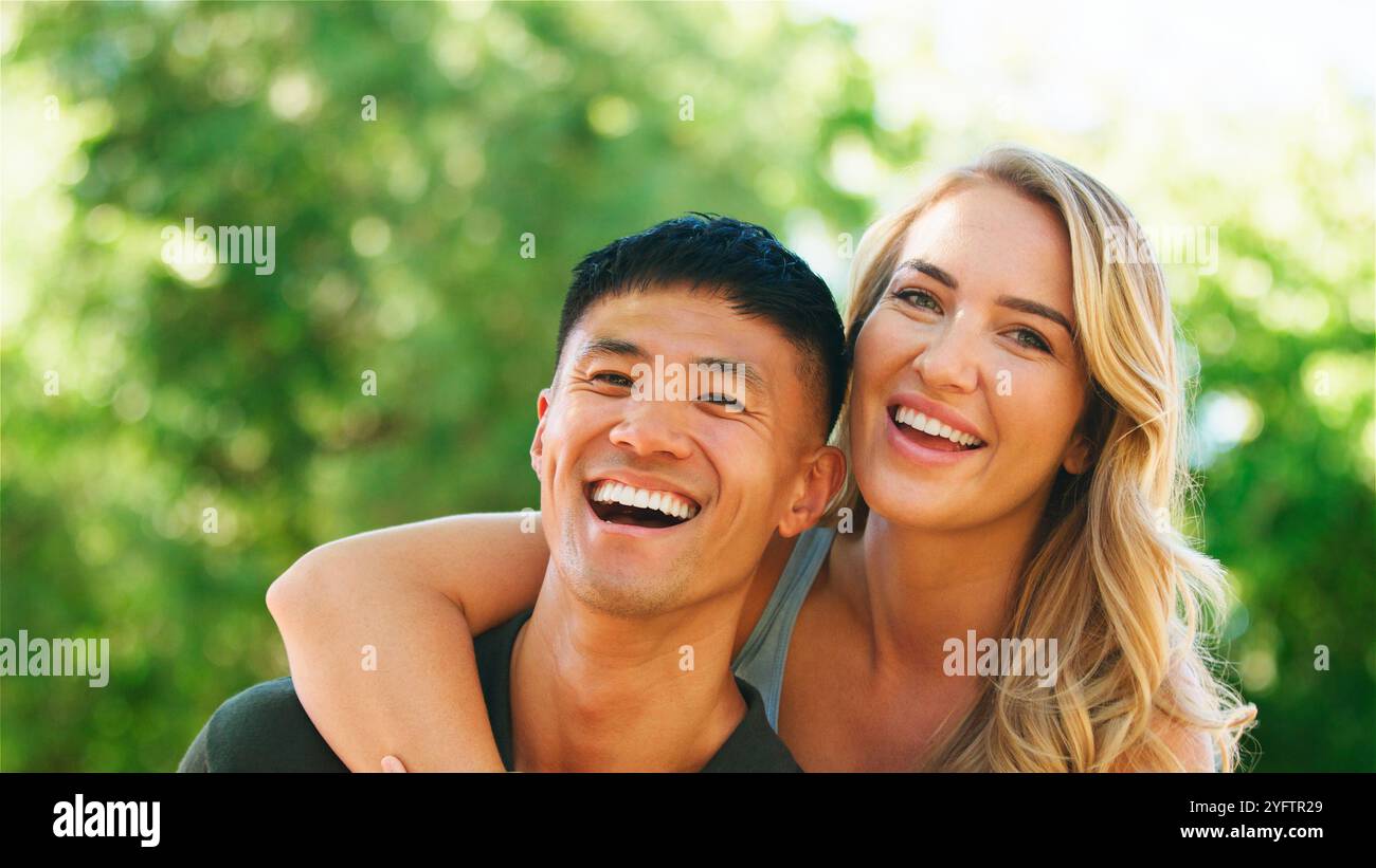 Joyful young couple embraces hi-res stock photography and images - Alamy