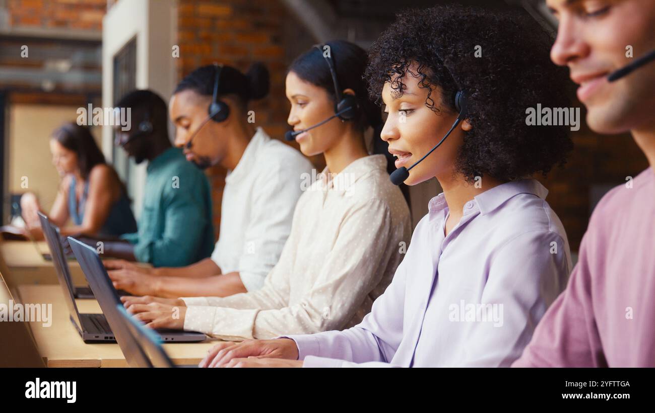 Multi-Cultural Customer Support Or Telesales Team In Modern Open Plan Office Wearing Headsets ...