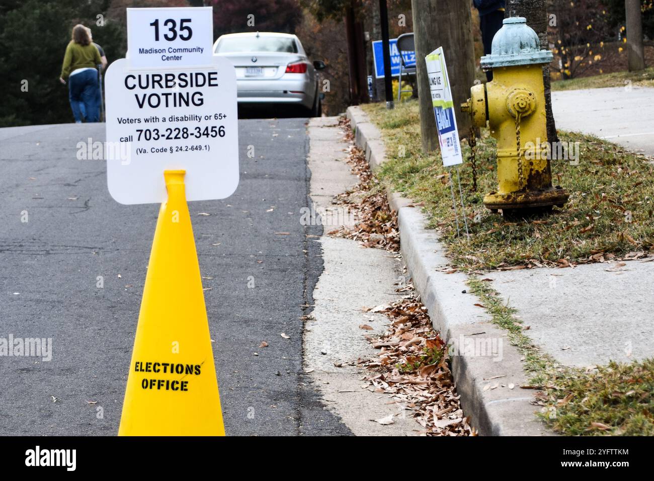 Sign identifying curbside voting spot at polling place on Election Day ...