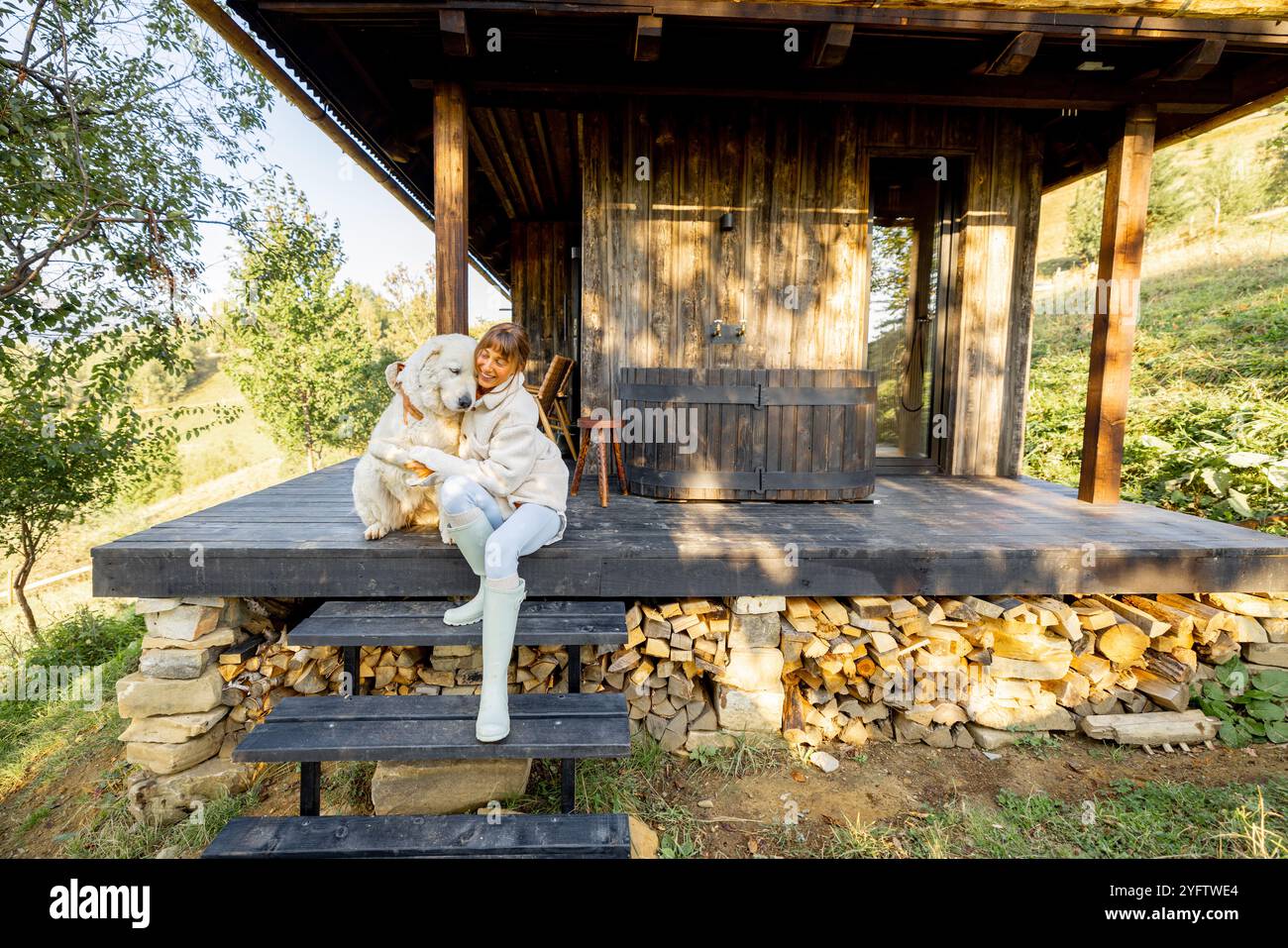 Hugging Dog on Porch Steps Stock Photo - Alamy