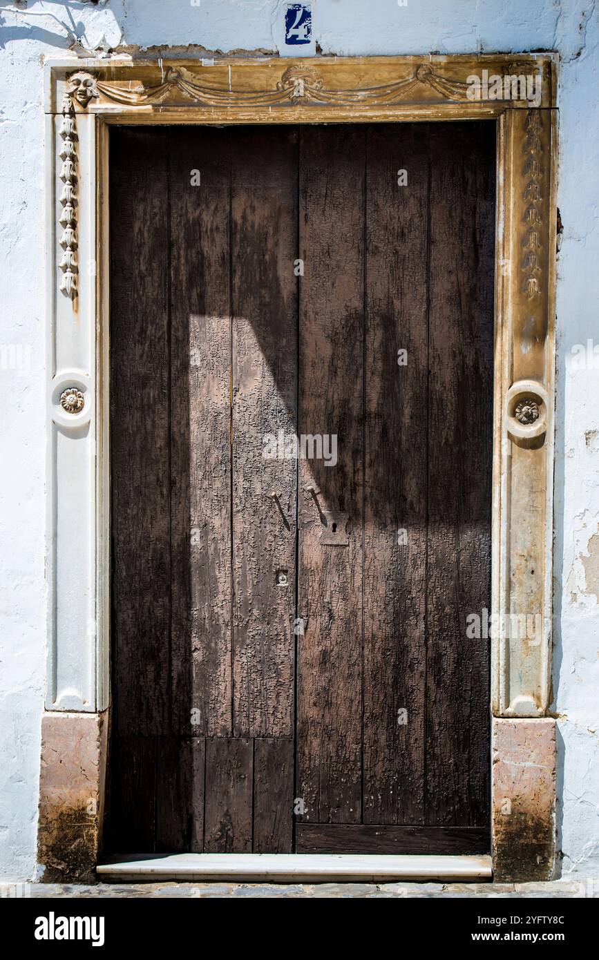 Old wooden door with shadow Stock Photo - Alamy