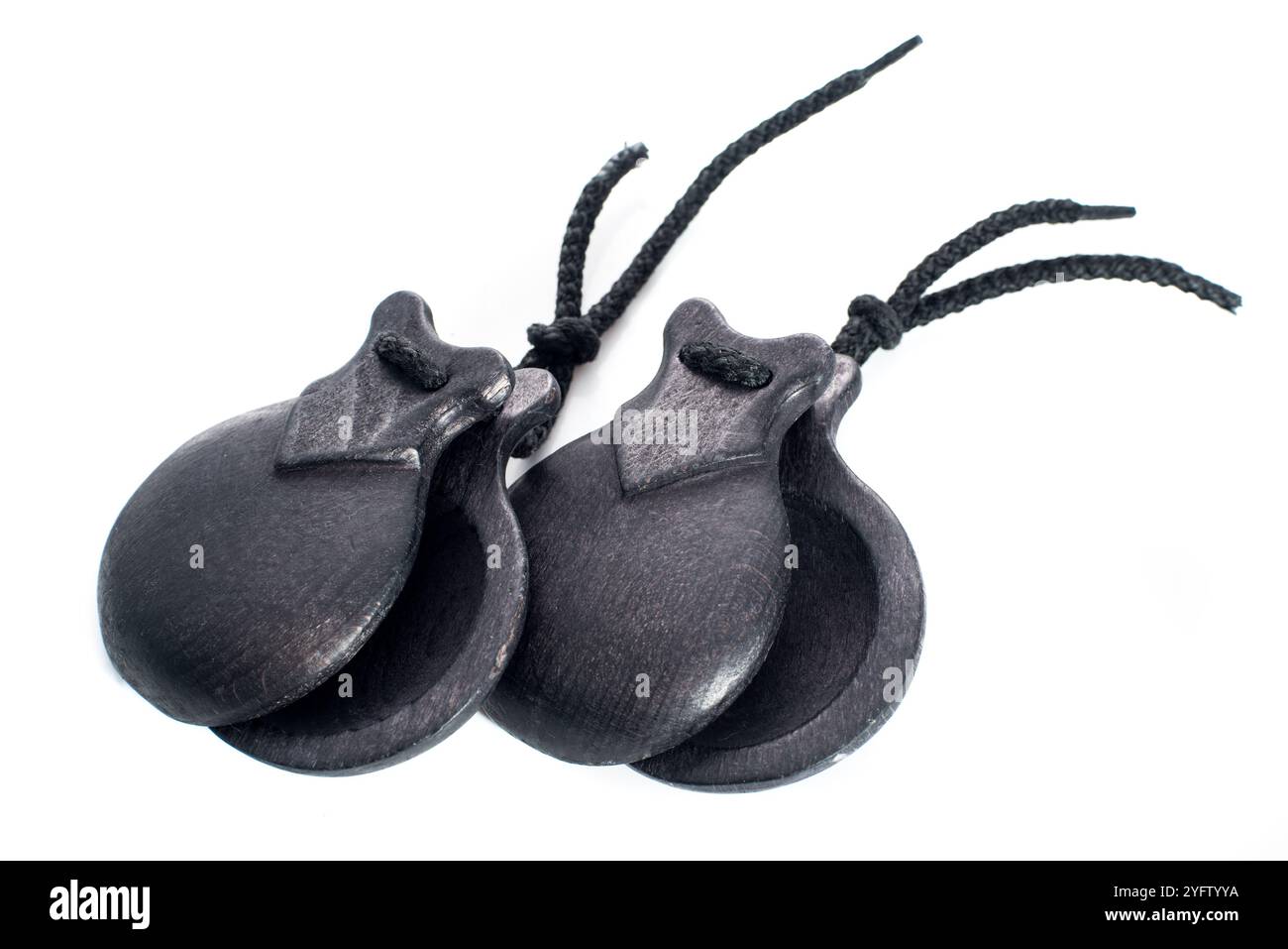 Two Spanish Castanets isolated on a white background Stock Photo - Alamy