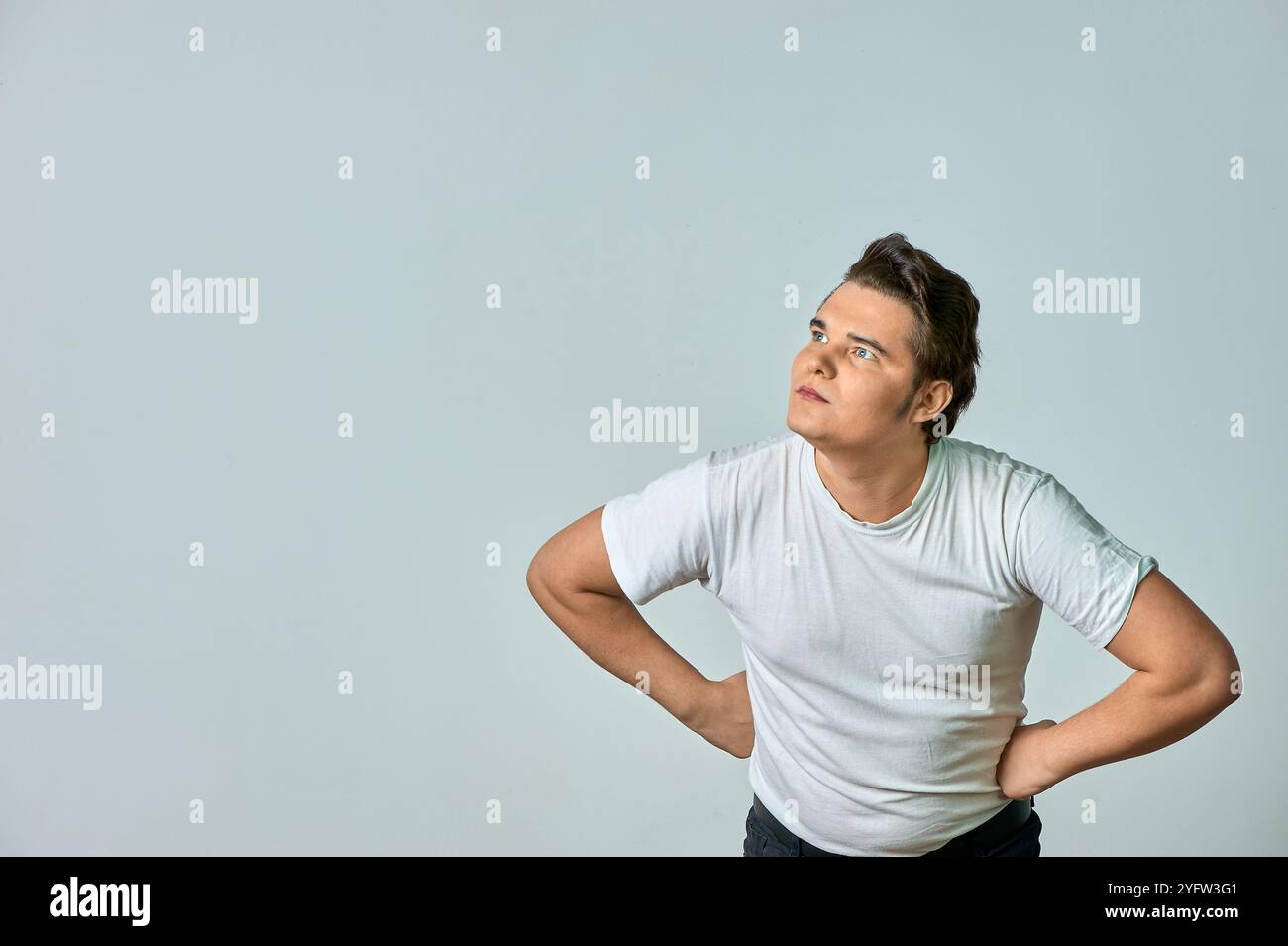 Angry, frowning man on a gray background, copy space Stock Photo - Alamy