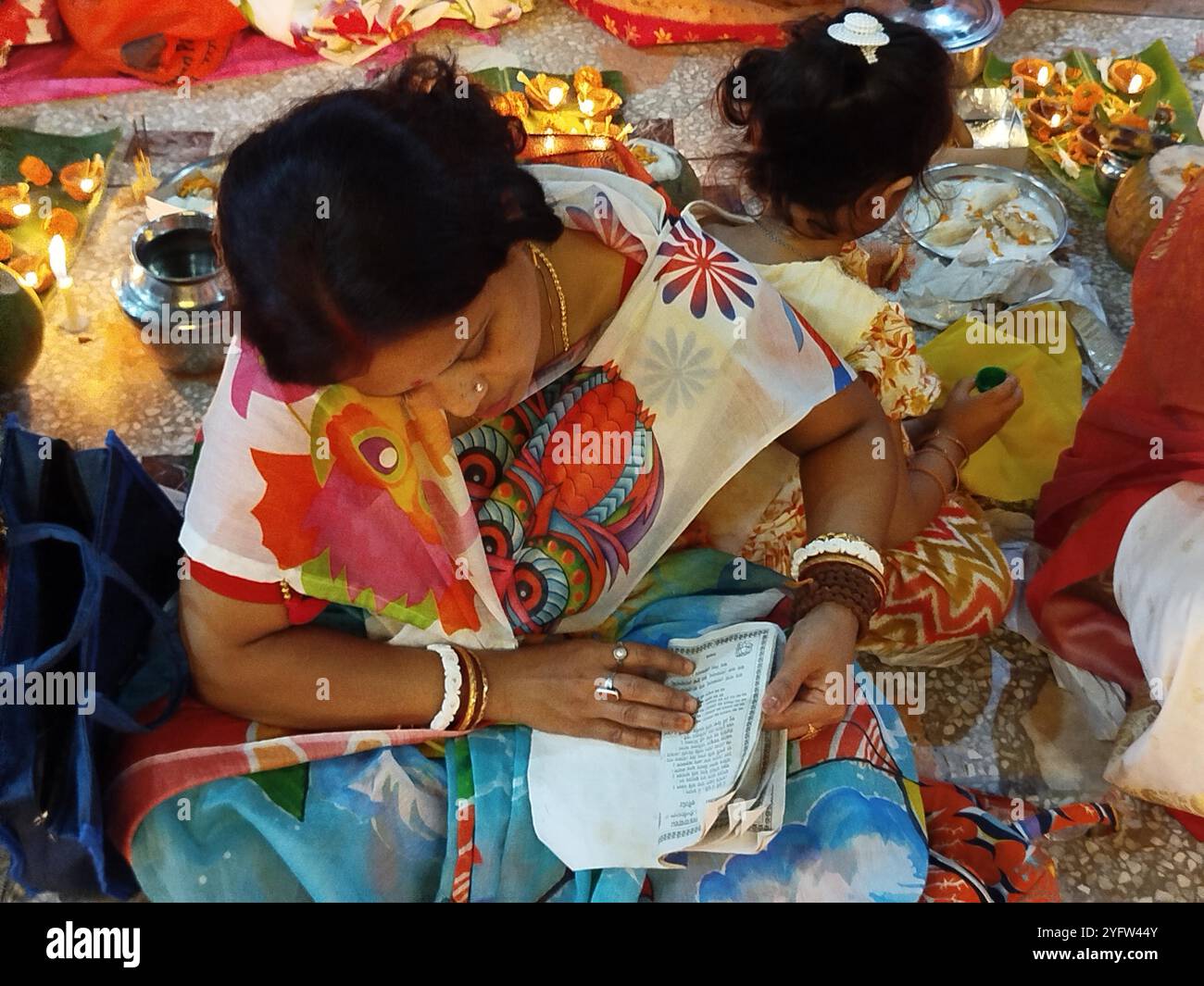 Dhaka, Bangladesh. 5th Nov, 2024. Hindu devotees sit on the floor ...