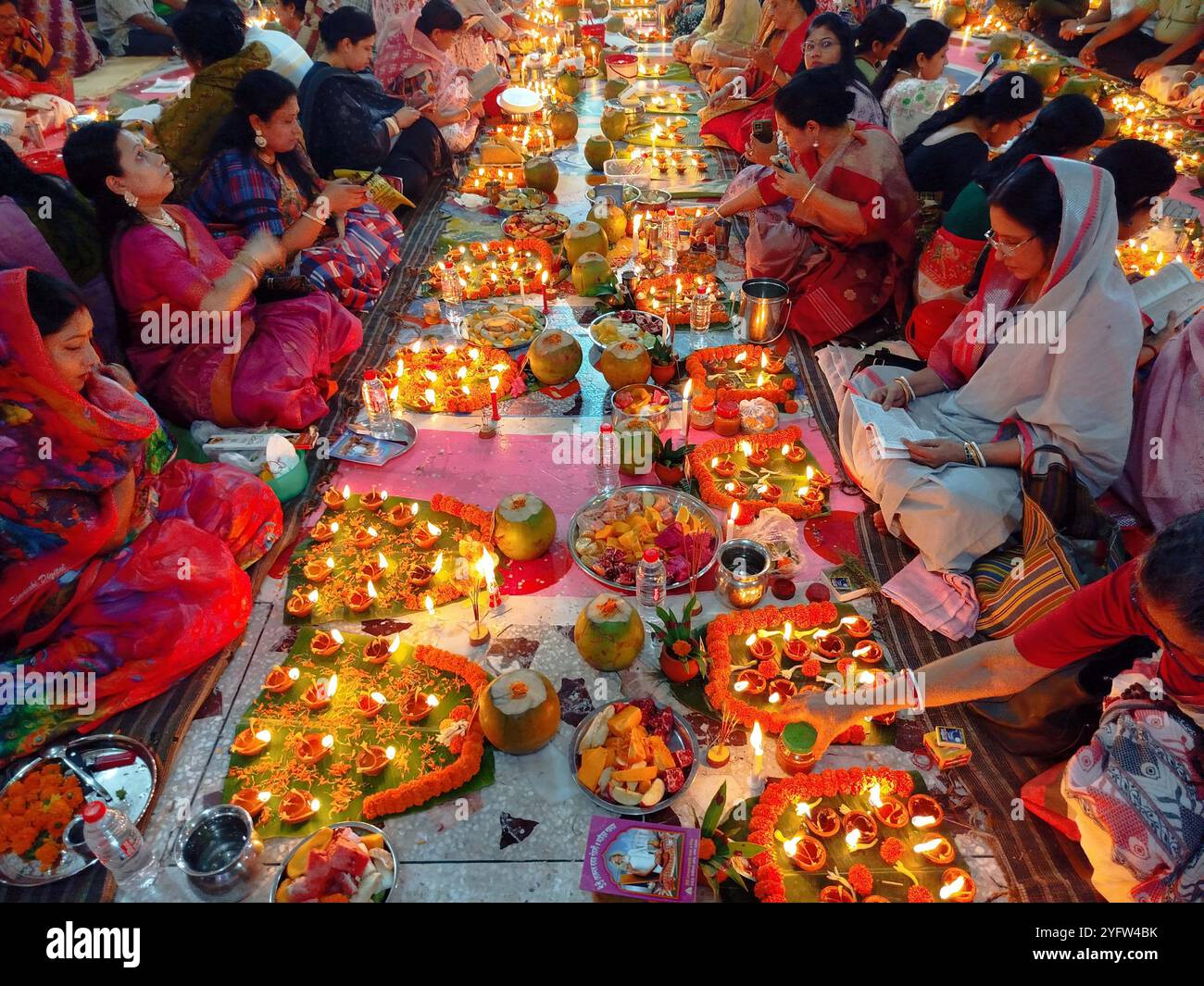 Dhaka, Bangladesh. 5th Nov, 2024. Hindu devotees sit on the floor ...