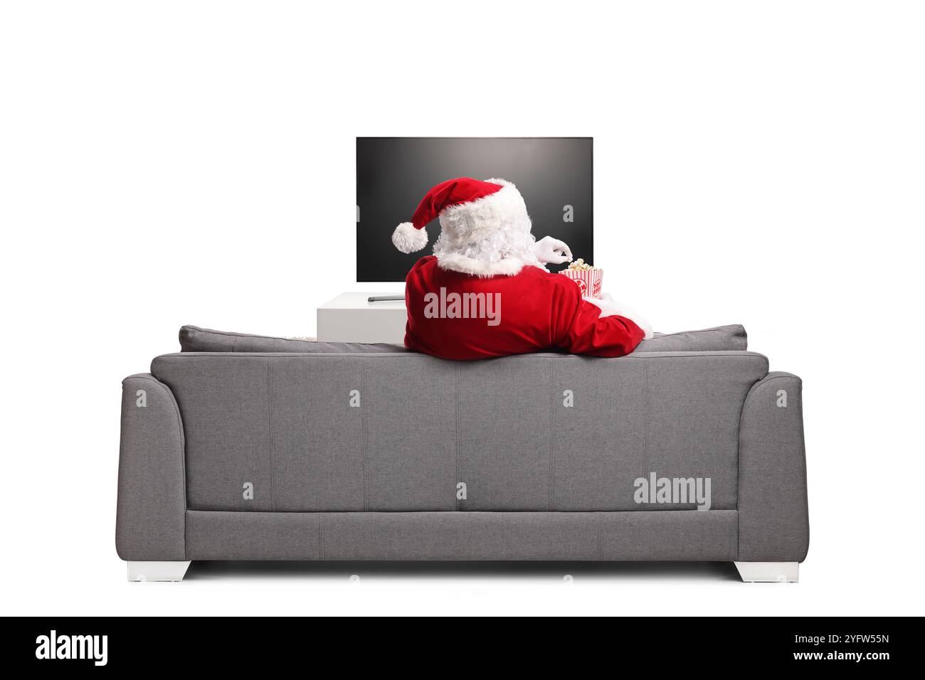 Rear view shot of Santa claus eating popcorn and watching tv isolated ...