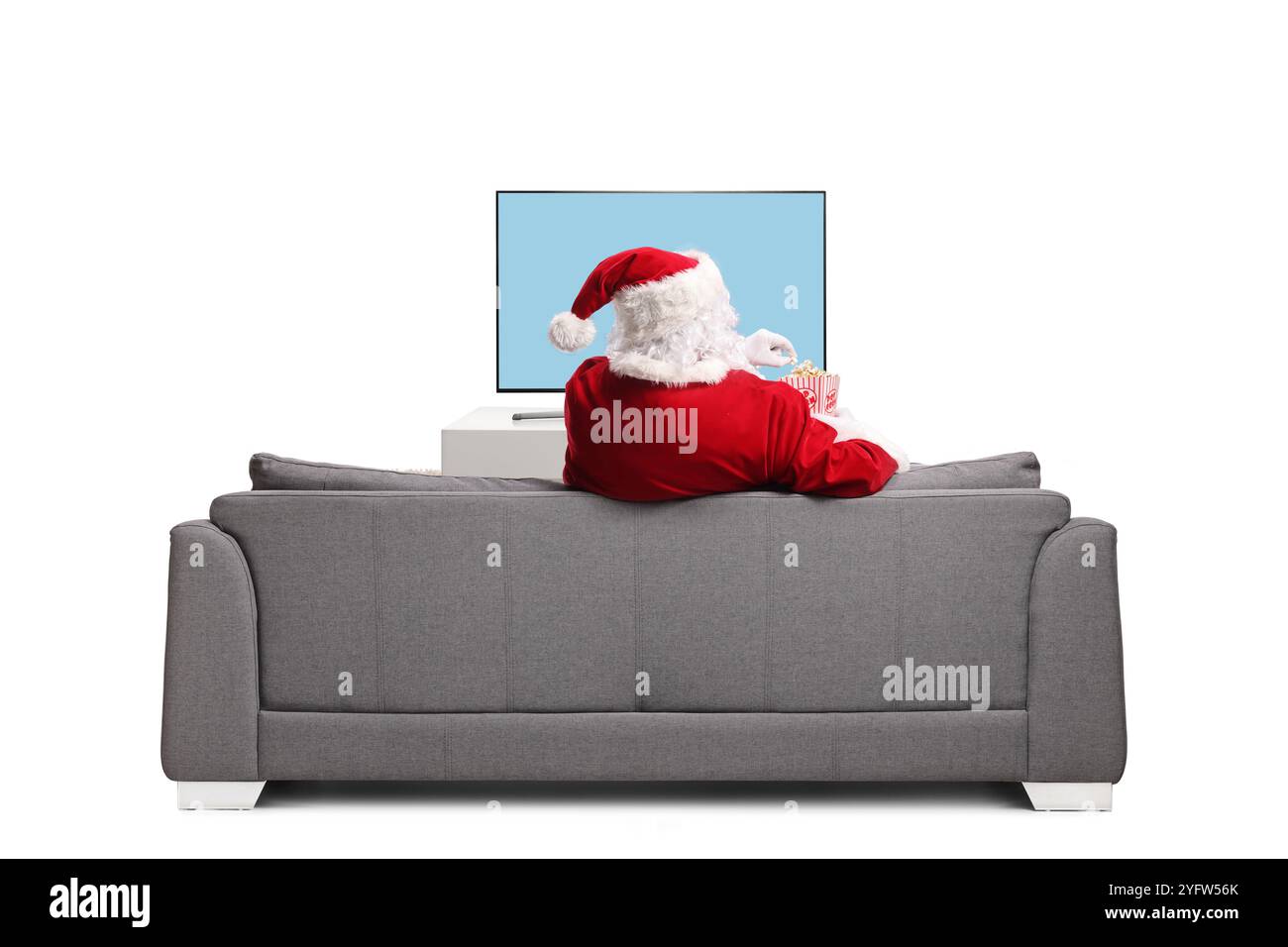 Santa claus eating popcorn and watching tv isolated on white background ...