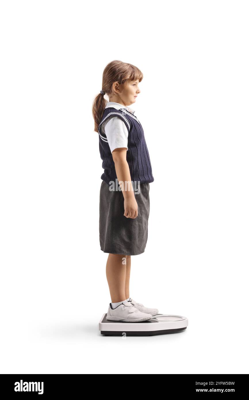 School kid at a routing doctor check, weight measure isolated on white ...