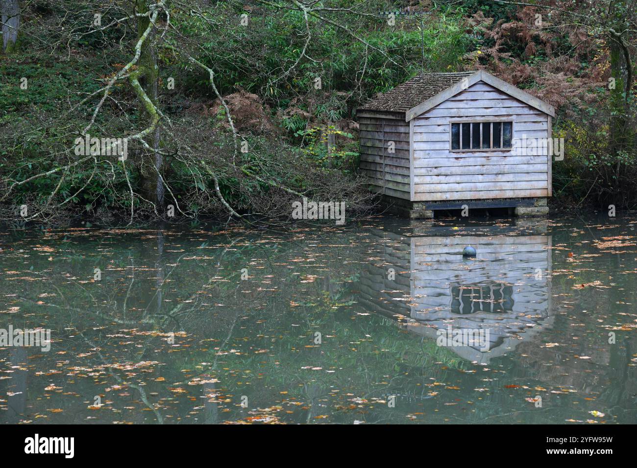 Shed with reflection in the pond Stock Photo - Alamy