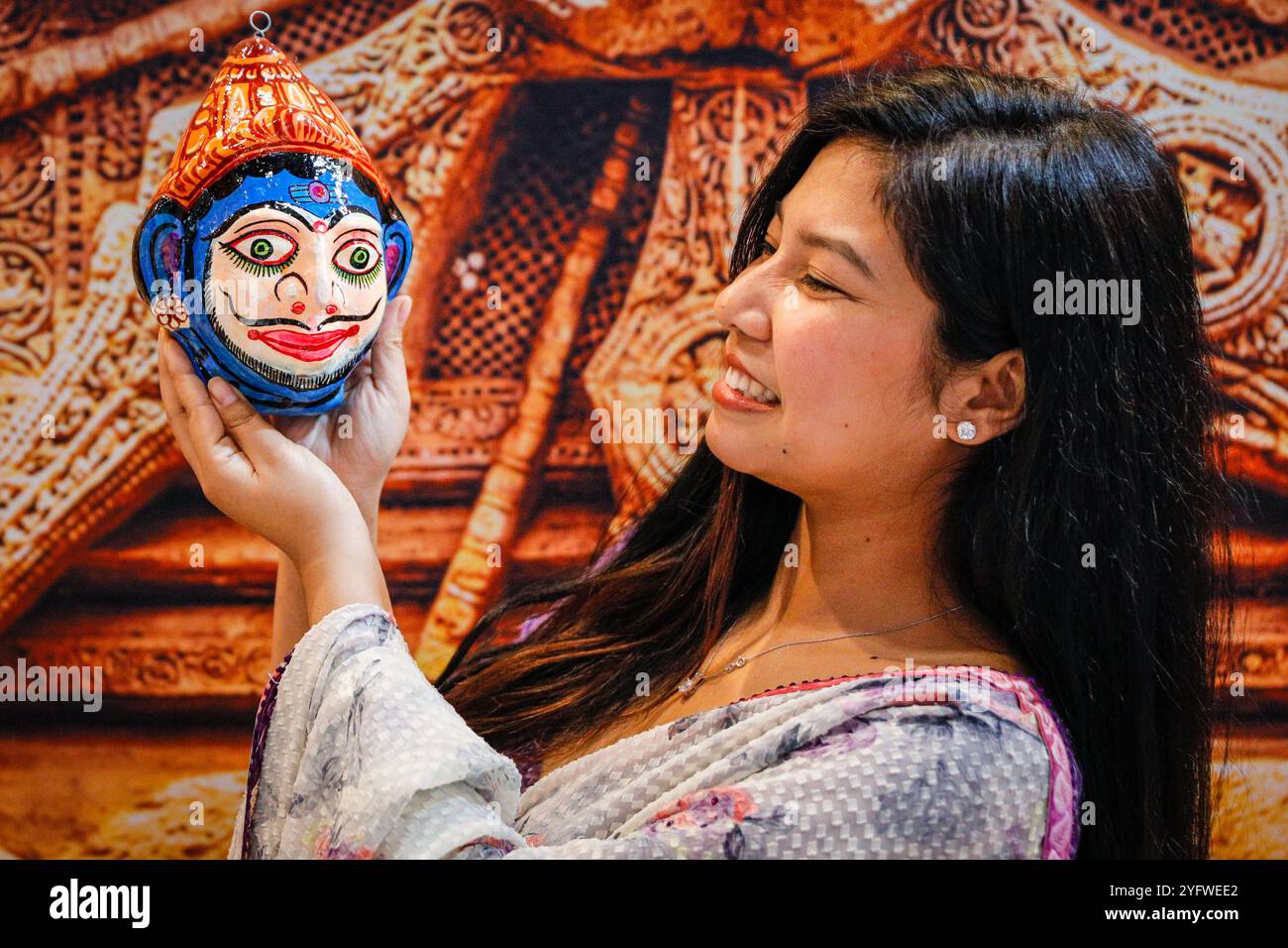 London, UK. 05th Nov, 2025. A representative with a traditional wooden ...