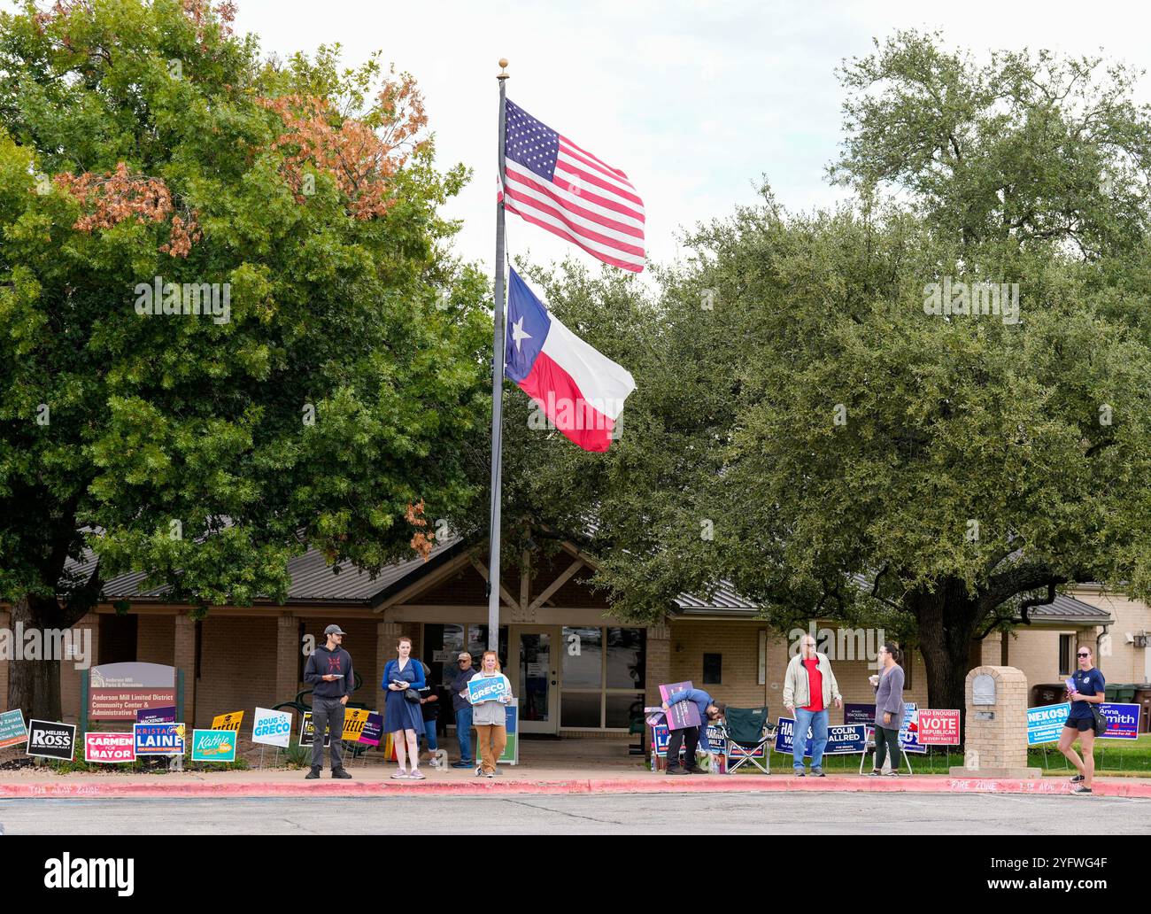 Austin, Texas, USA. 5th Nov, 2024. Campaign workers greet voters ...
