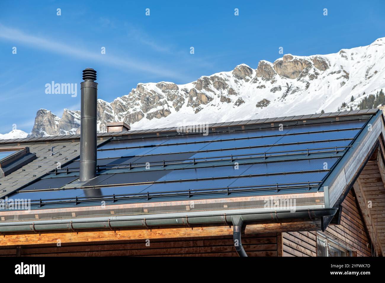 House roof with solar panels in the Swiss Alps Stock Photo - Alamy