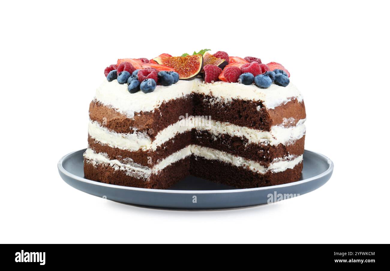 Cut delicious chocolate sponge cake with berries isolated on white ...