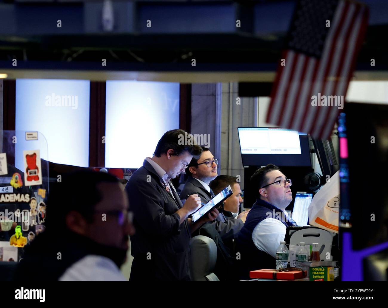 New York, United States. 05th Nov, 2024. Traders work on the floor of ...