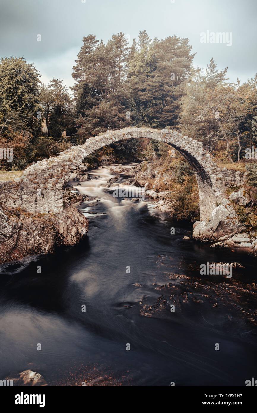 The 18th century stone packhorse bridge across the River Dulnain in the ...