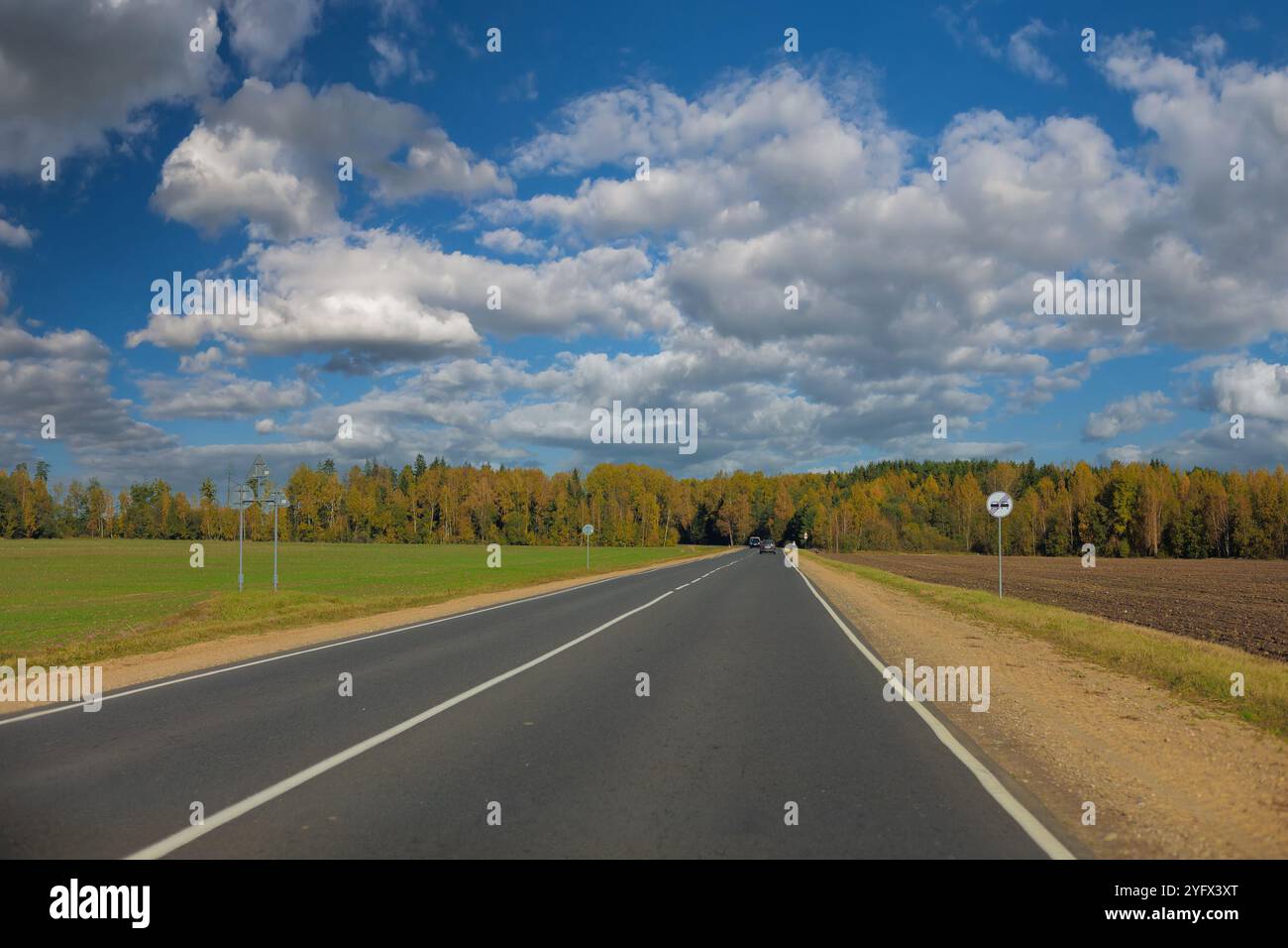 Evening view at sunset. Highway road in the countryside, roadside and ...