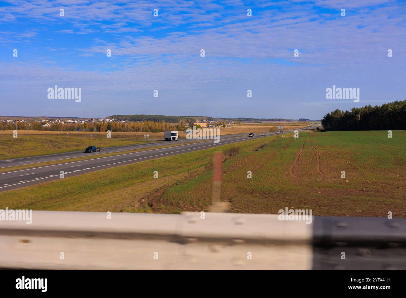 Evening view at sunset. Highway road in the countryside, roadside and ...
