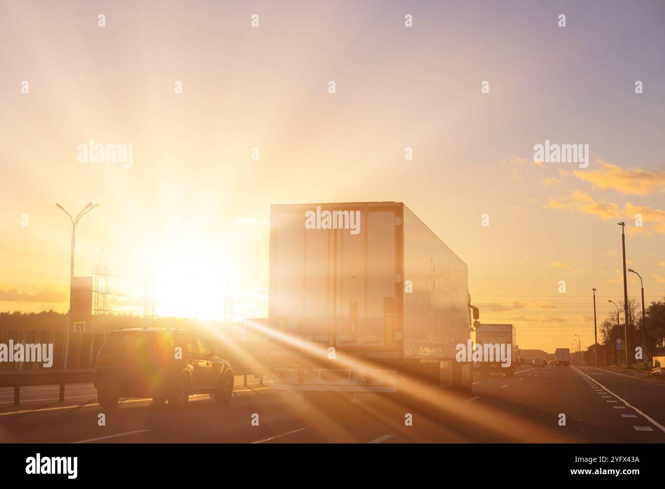 Evening view at sunset. Highway road in the countryside, roadside and ...