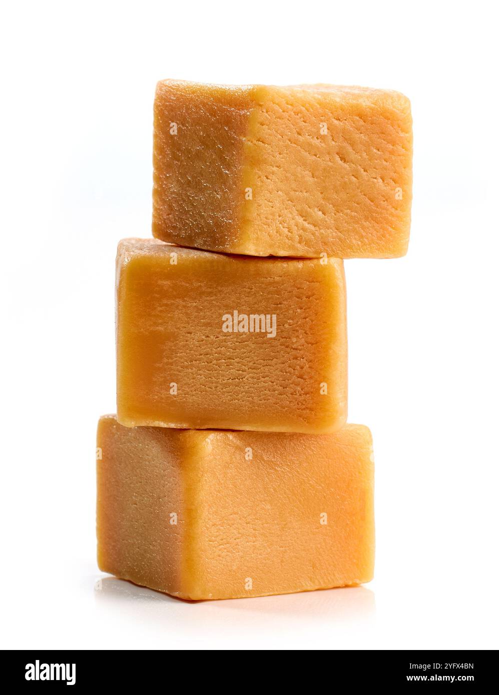 stack of caramel candies isolated on white background Stock Photo - Alamy