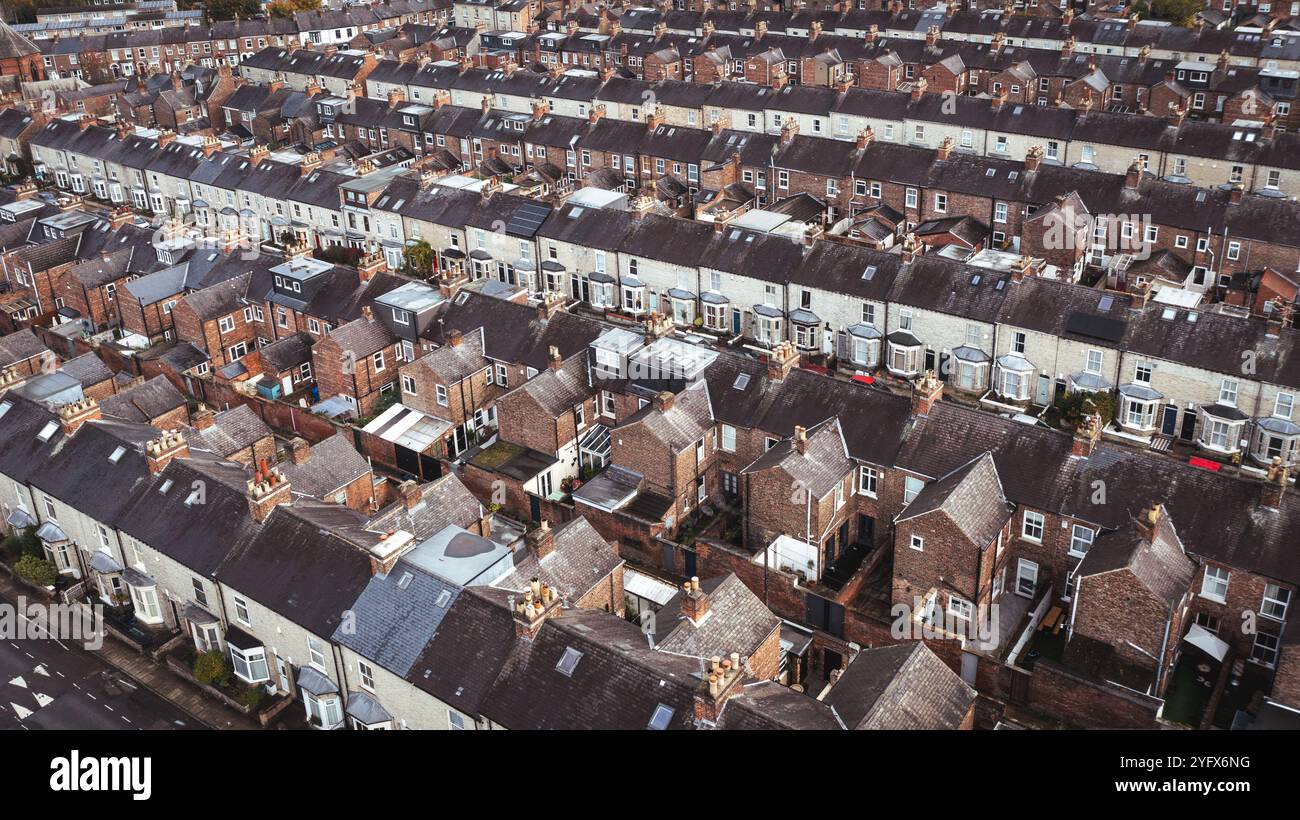 An aerial view above the rooftops of run down back to back terraced ...