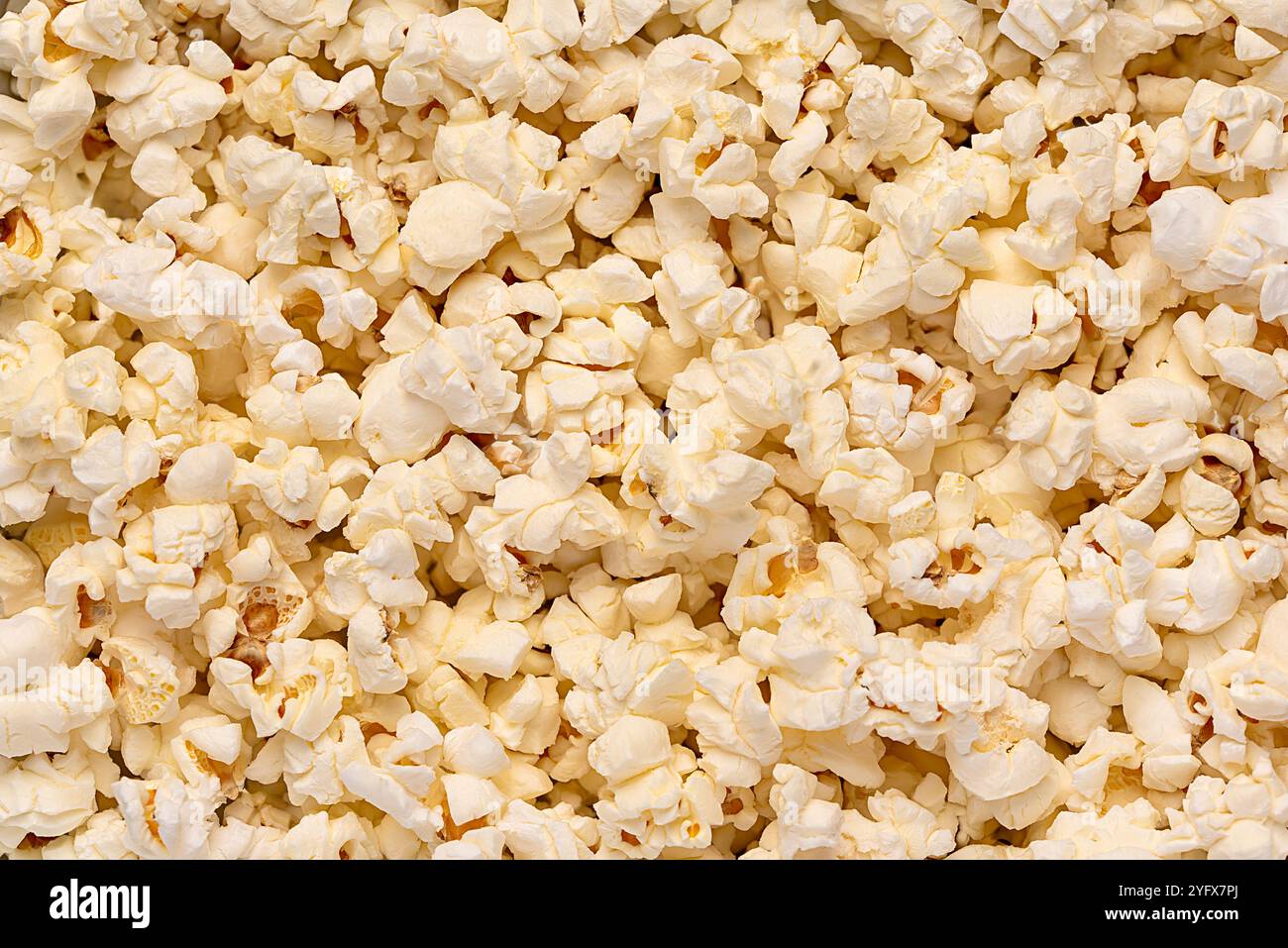 Macro photography of buttered popcorn; corn snack, vegan food, textured ...